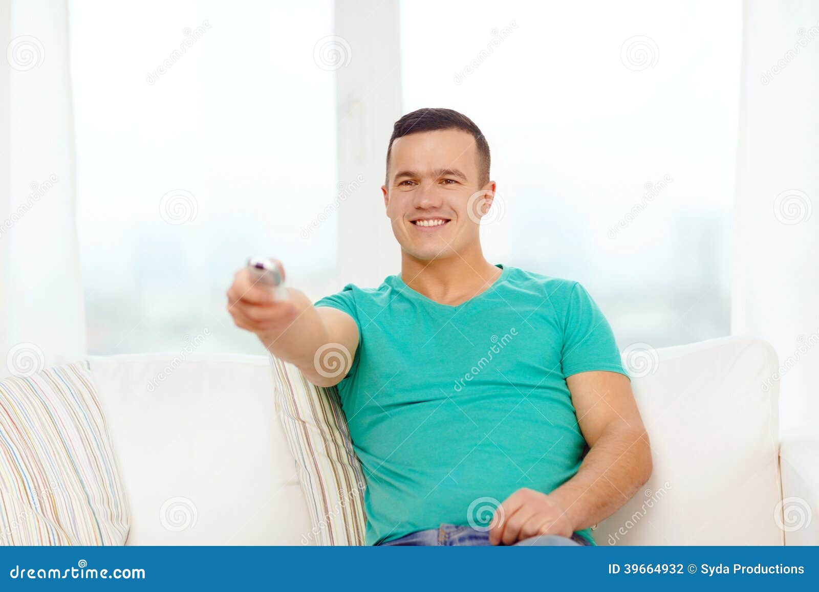 Smiling Man with Tv Remote Control at Home Stock Photo - Image of ...