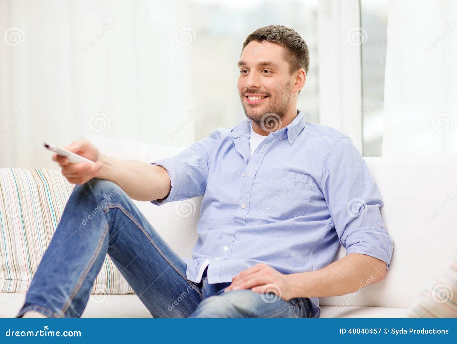 Smiling Man with Tv Remote Control at Home Stock Image - Image of ...
