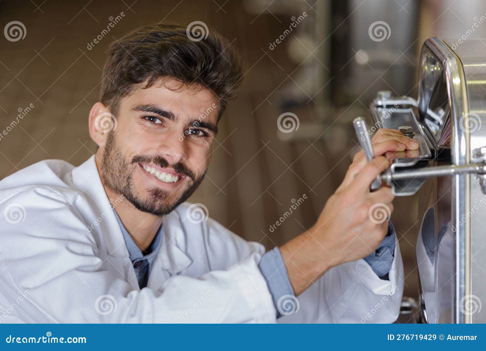 Smiling Man in Uniform Working in Wine Secondary Fermentation Section ...