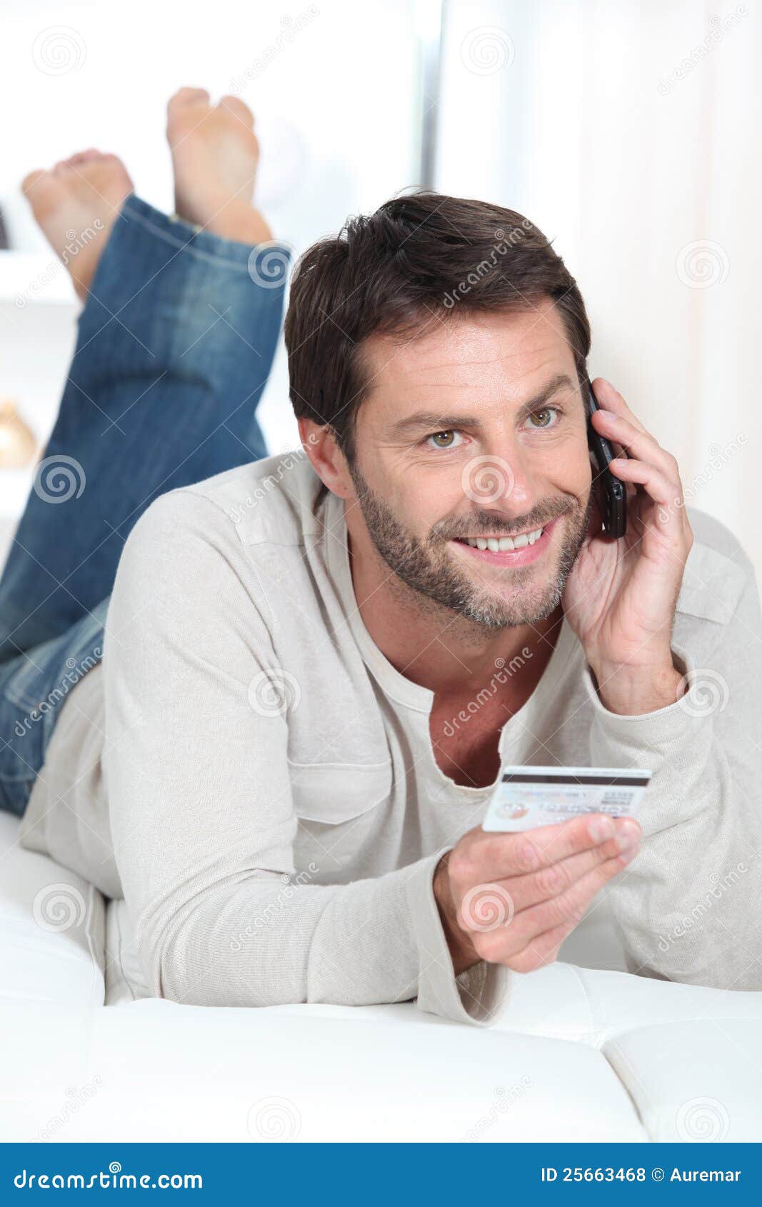 Smiling Man Using a Credit Card Stock Photo - Image of relaxed, card ...