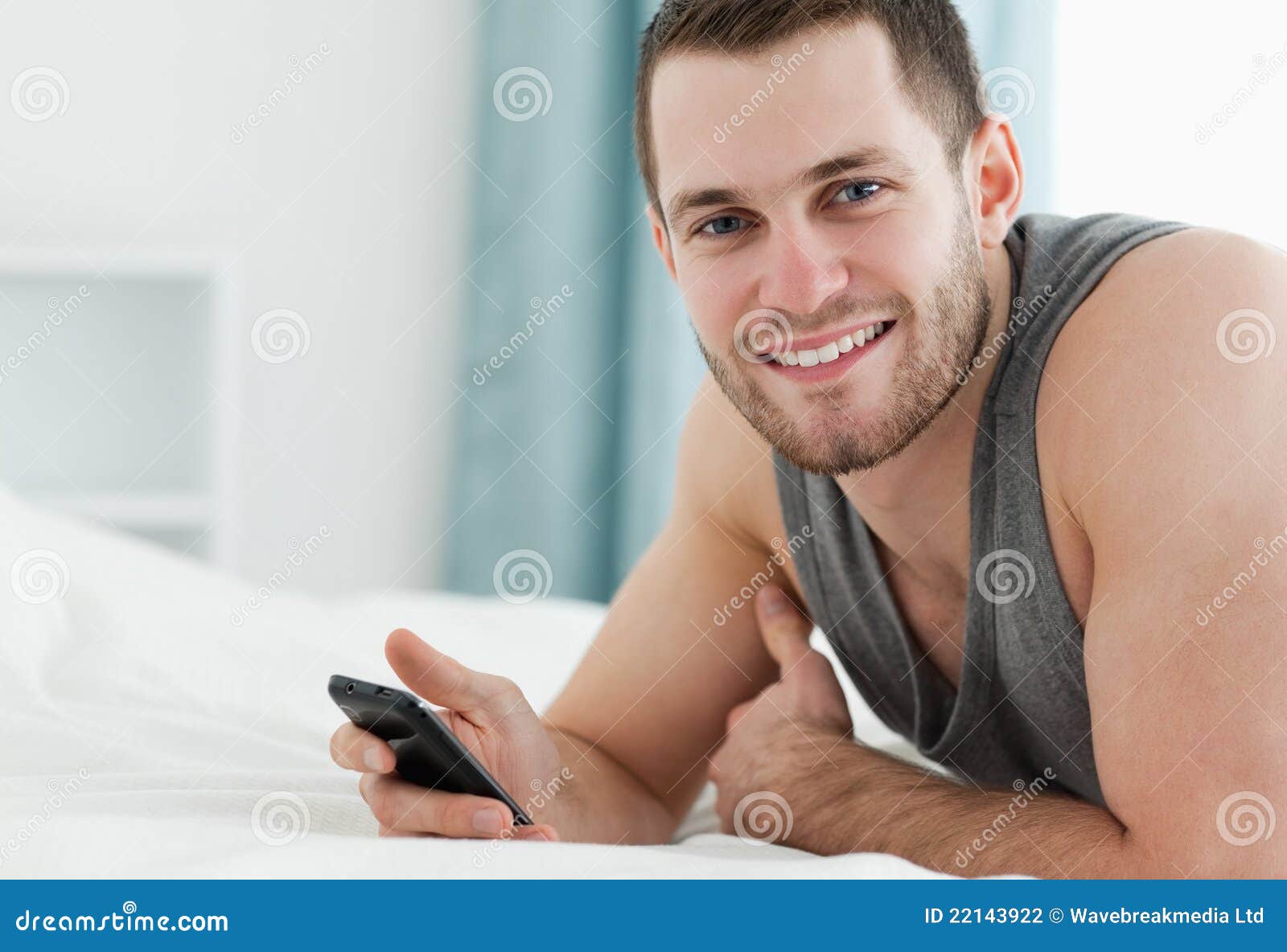Smiling Man Using His Mobile Phone Stock Photo - Image of phone, person ...