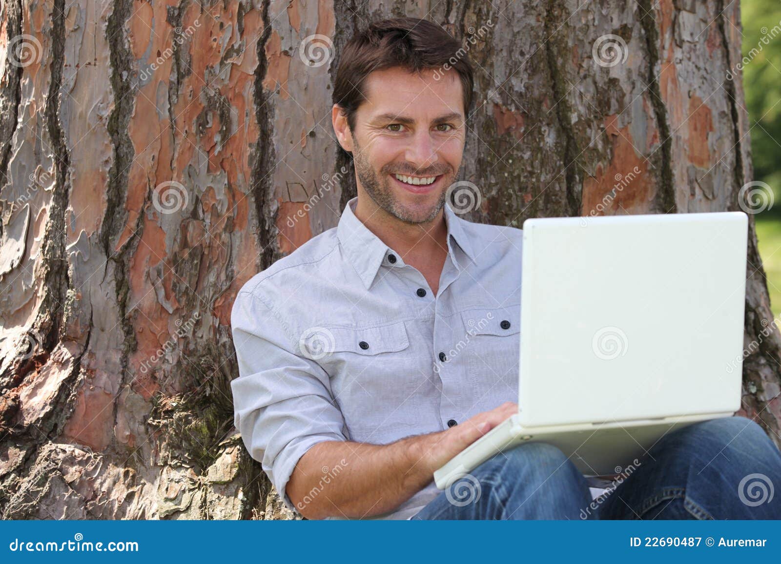 Smiling man using laptop stock image. Image of adult - 22690487 Smiling man using laptop stock image. Image of adult - 22690487