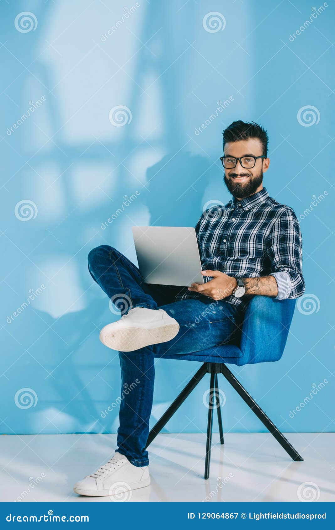 Smiling Man Using Laptop and Sitting in Armchair Stock Image - Image of ... Smiling Man Using Laptop and Sitting in Armchair Stock Image - Image of ...
