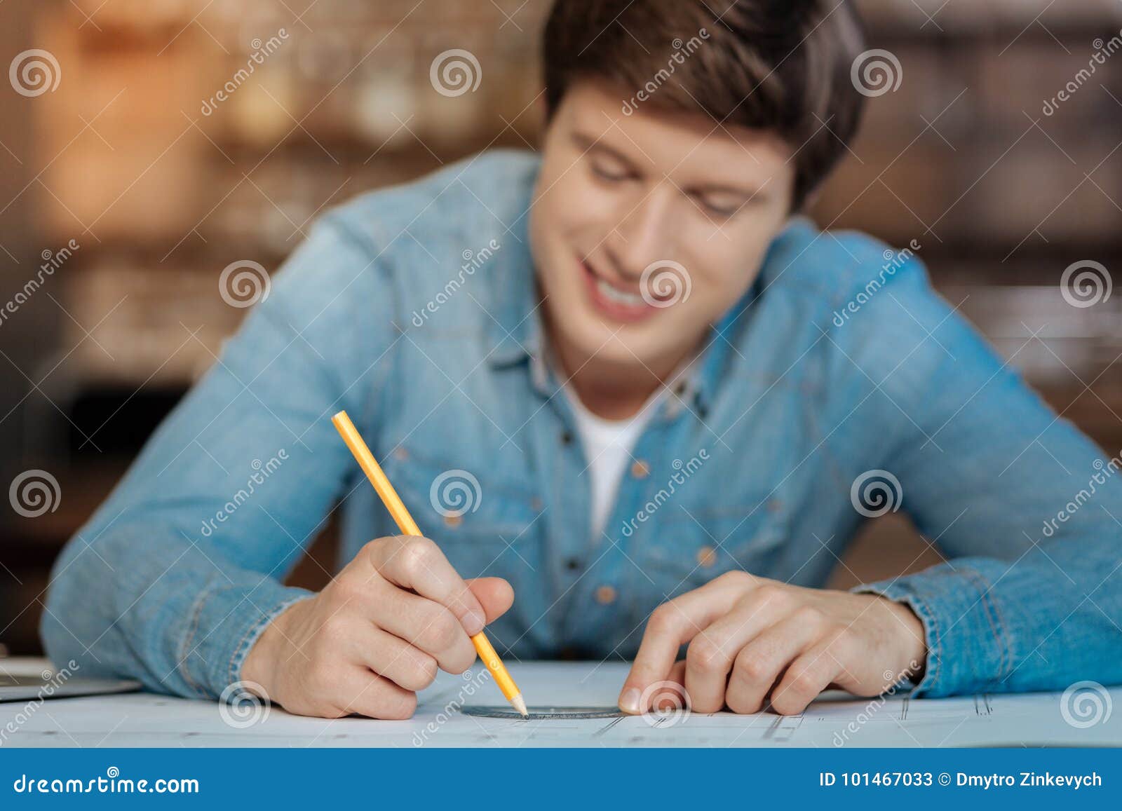 Smiling Man Using a Protractor while Drawing Blueprint Stock Image ...
