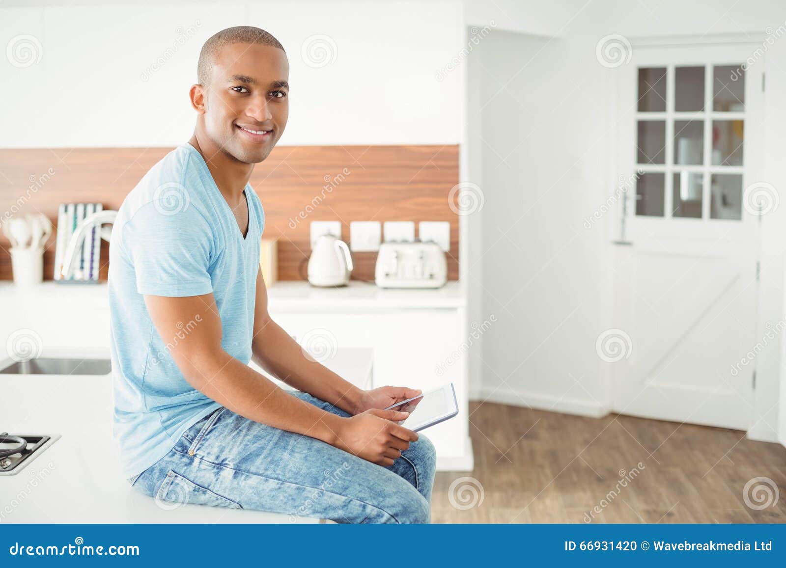 Smiling Man Using Tablet in the Kitchen Stock Photo - Image of leisure ...