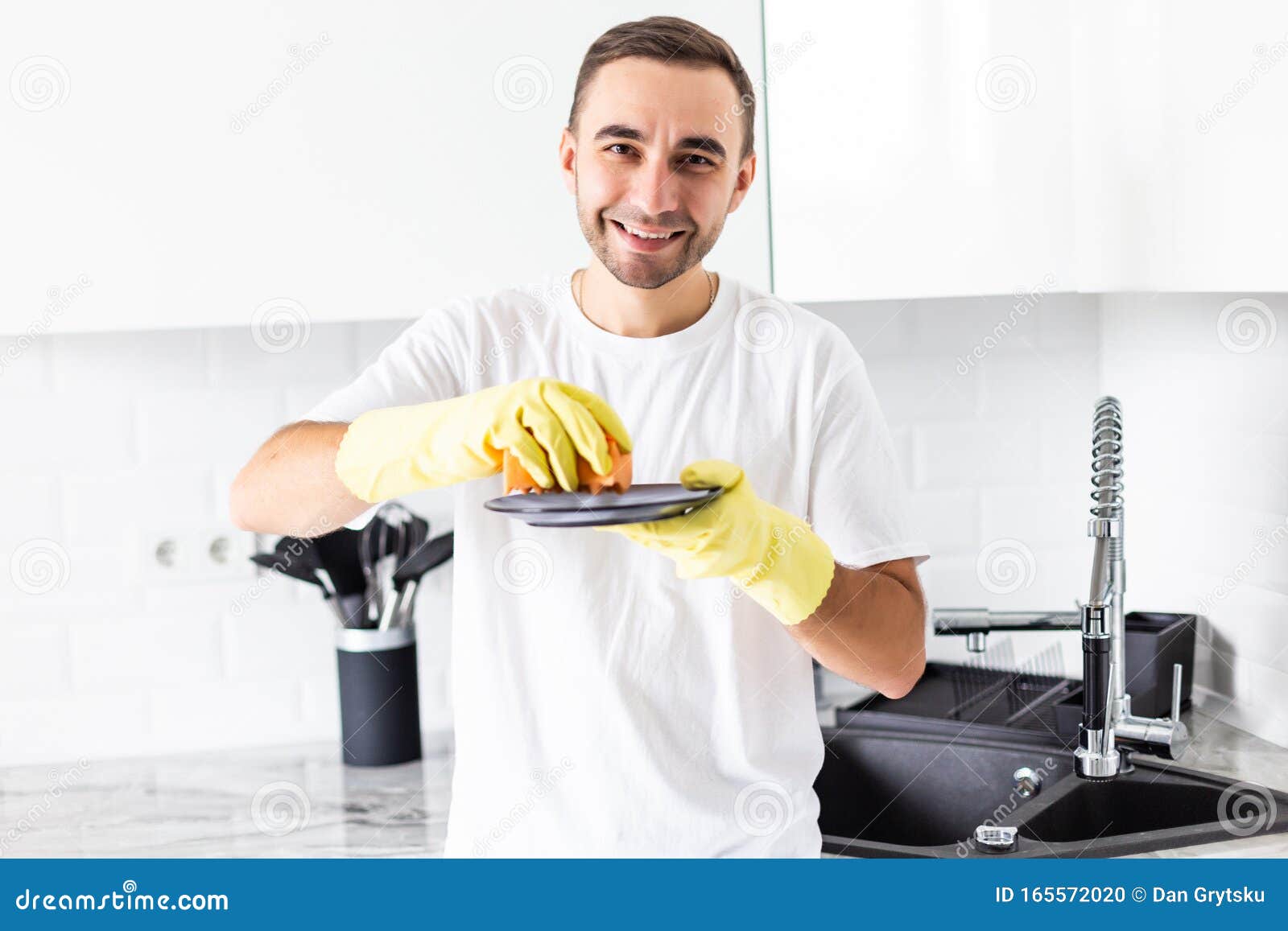Smiling Handsome Man Washing Dish in the Kitchen Stock Photo - Image of ...