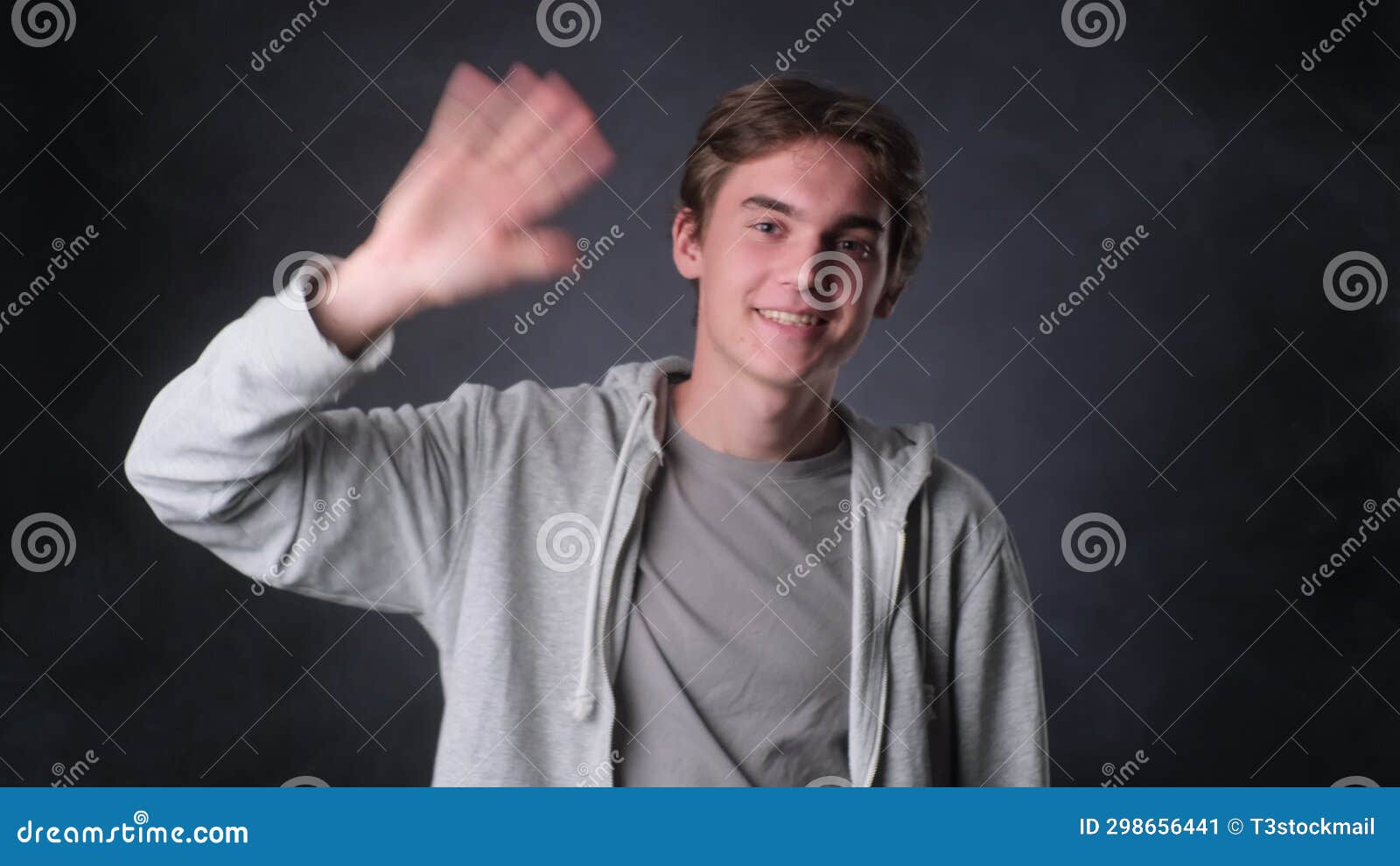 Smiling Man Waving Hand on Black Background Stock Video - Video of ...