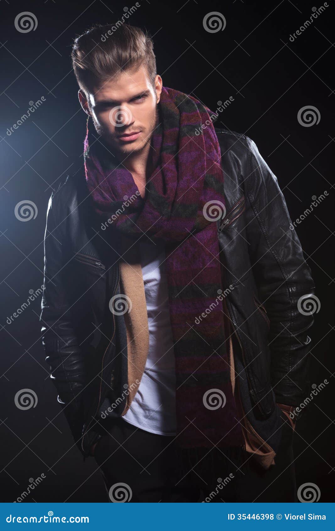 Smiling Man Wearing Leather Jacket is Standing with Hands in Pockets ...