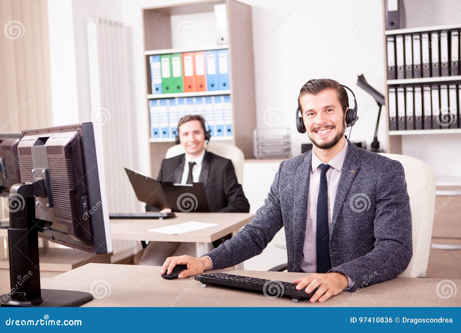 Smiling Man Working at Customer Service Support in the Office Stock ...