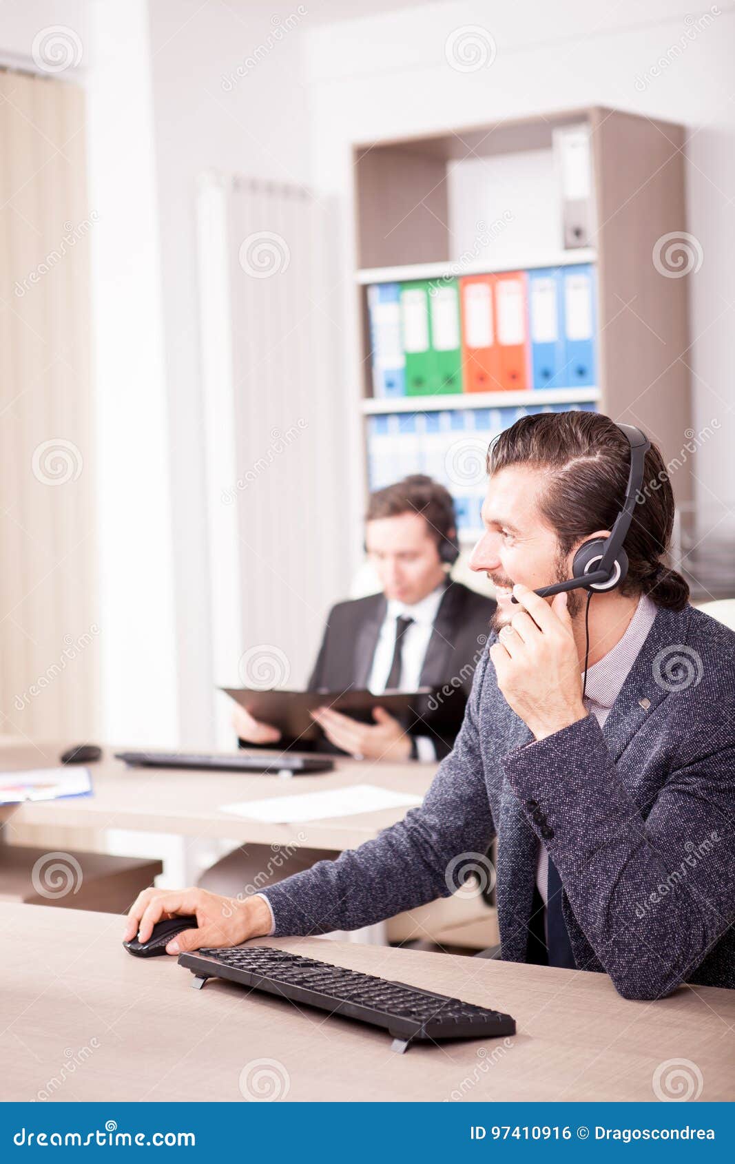 Smiling Man Working at Customer Service Support in the Office Stock ...
