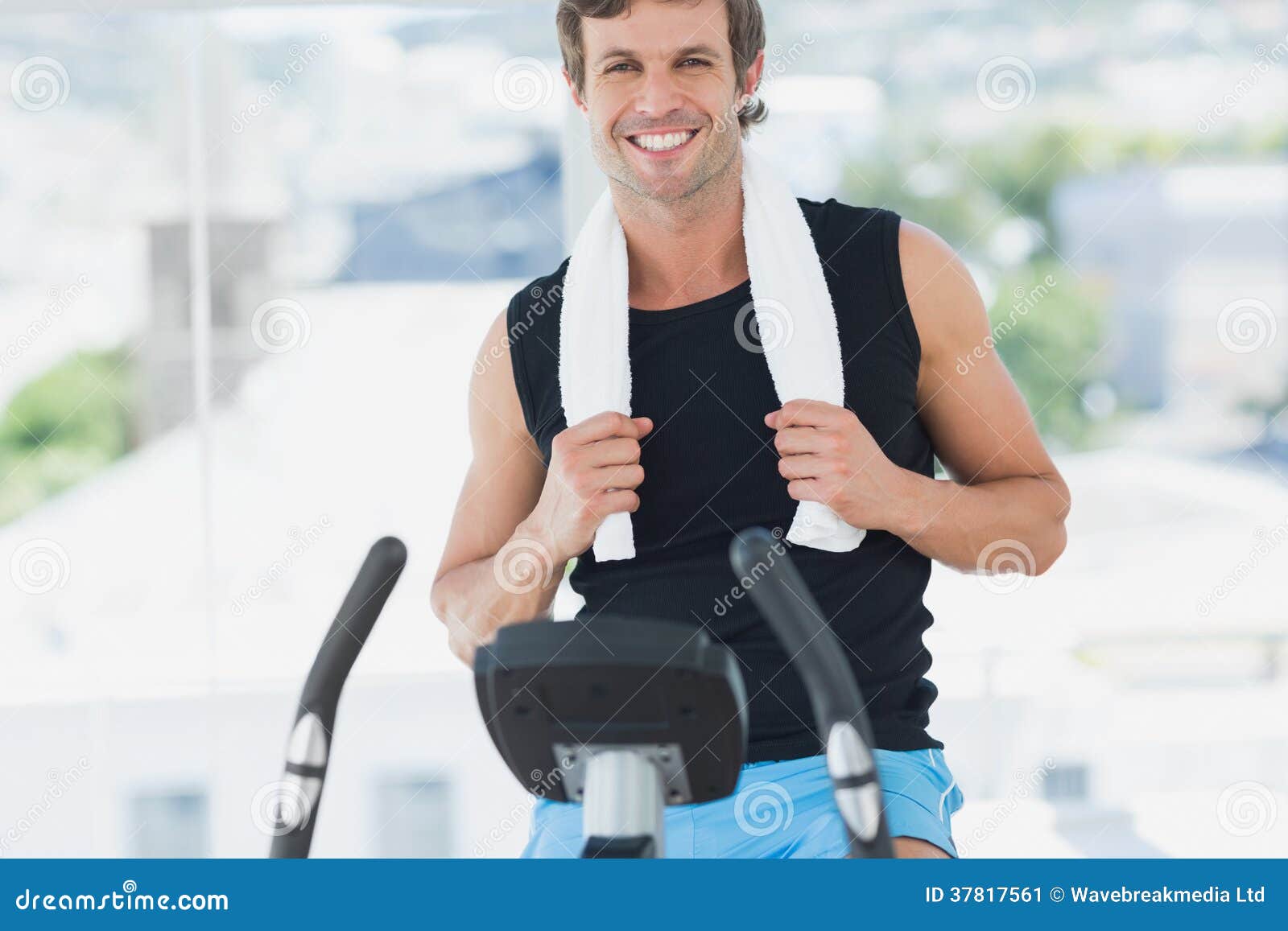 Smiling Man Working Out at Spinning Class in Bright Gym Stock Image ...