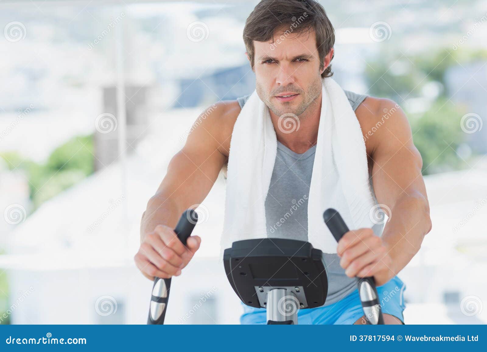 Smiling Man Working Out at Spinning Class in Bright Gym Stock Photo ...