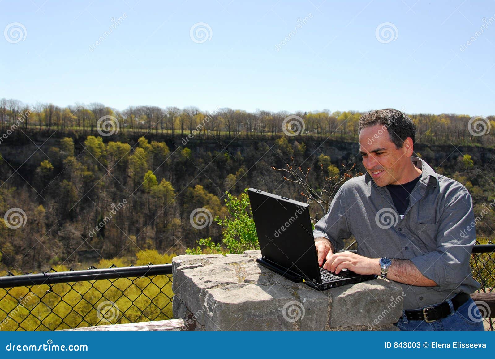 Smiling Man Working Outdoors Stock Image - Image of person, portable ...
