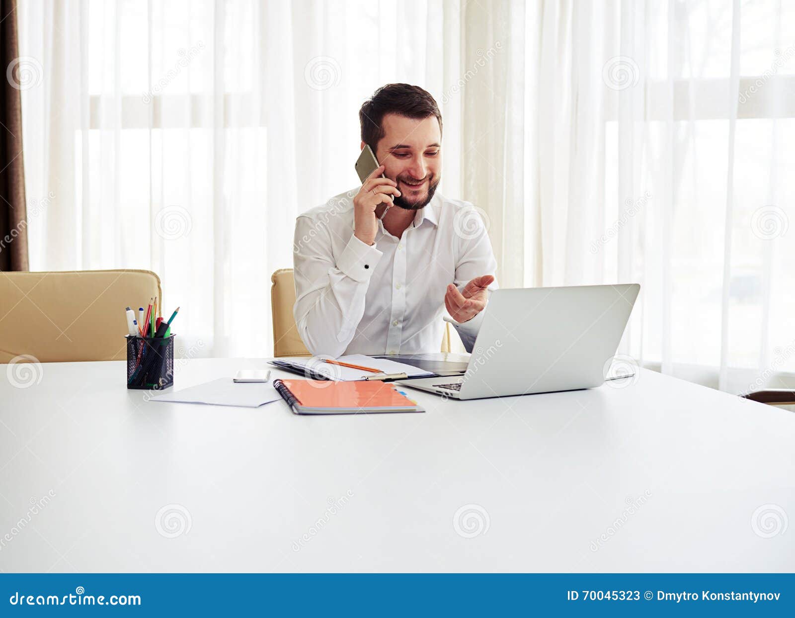 Smiling Man Working and Talking on the Phone in the Modern Offic Stock ...