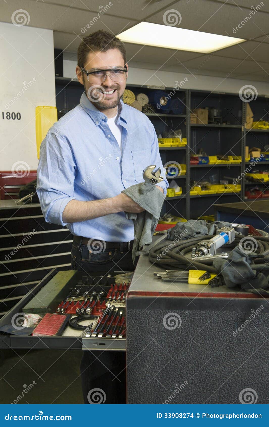 Smiling Man in Workshop with Tools Stock Photo - Image of rack ...