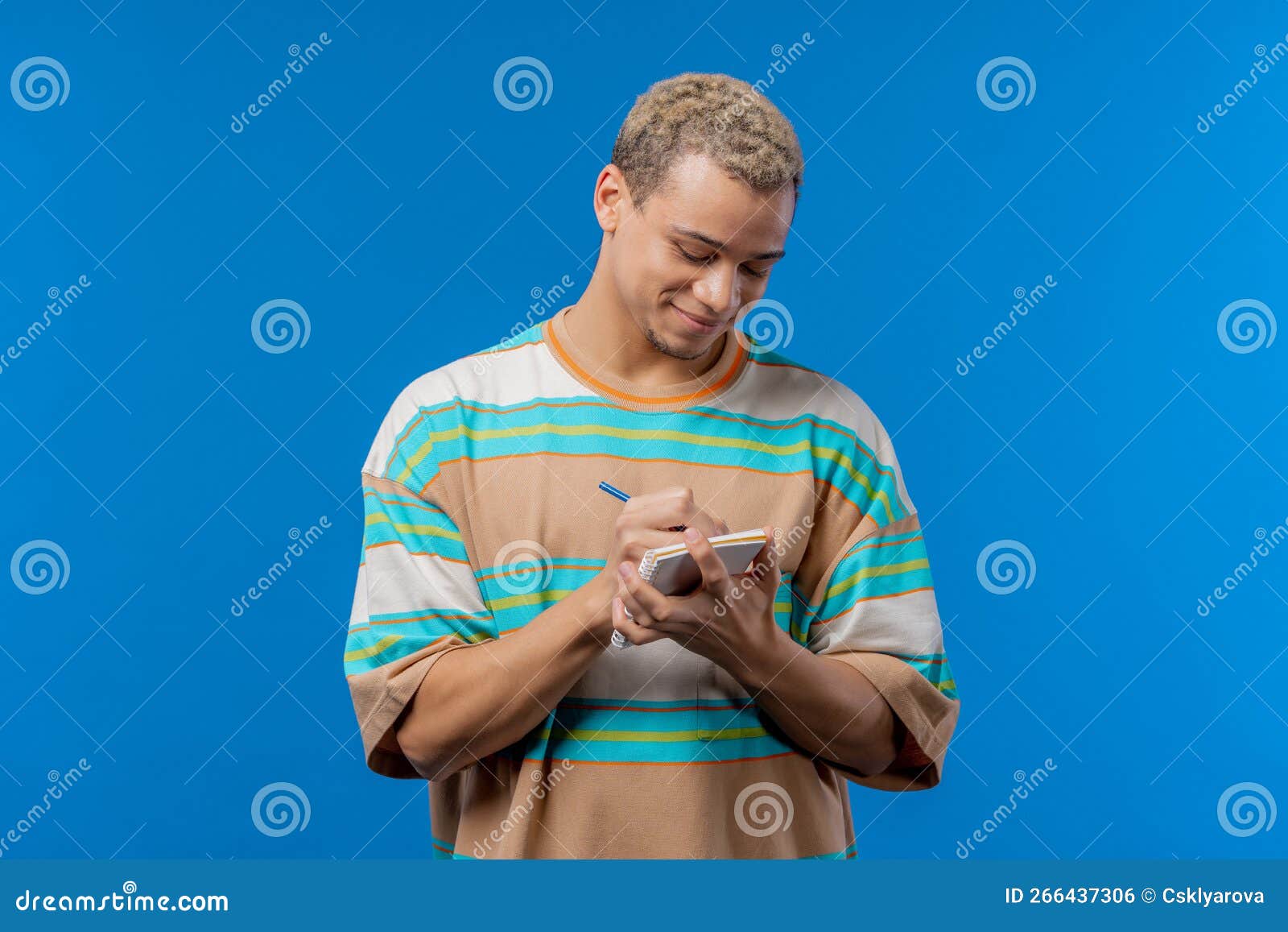 Smiling Man Writing Notes in Planner with Pen. Student Guy Writes ...
