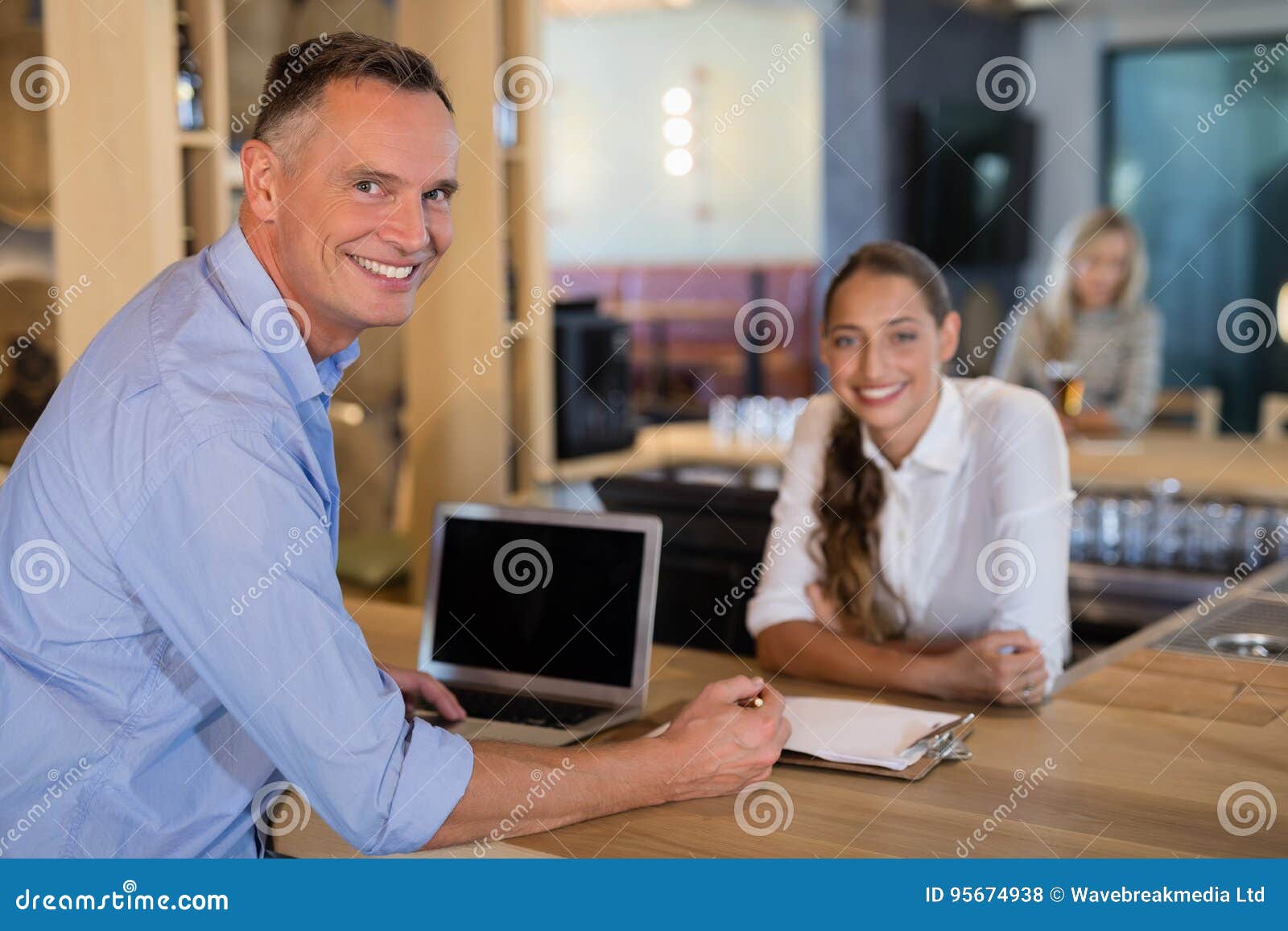 Smiling Manager and Bartender Standing at Bar Counter Stock Photo ...