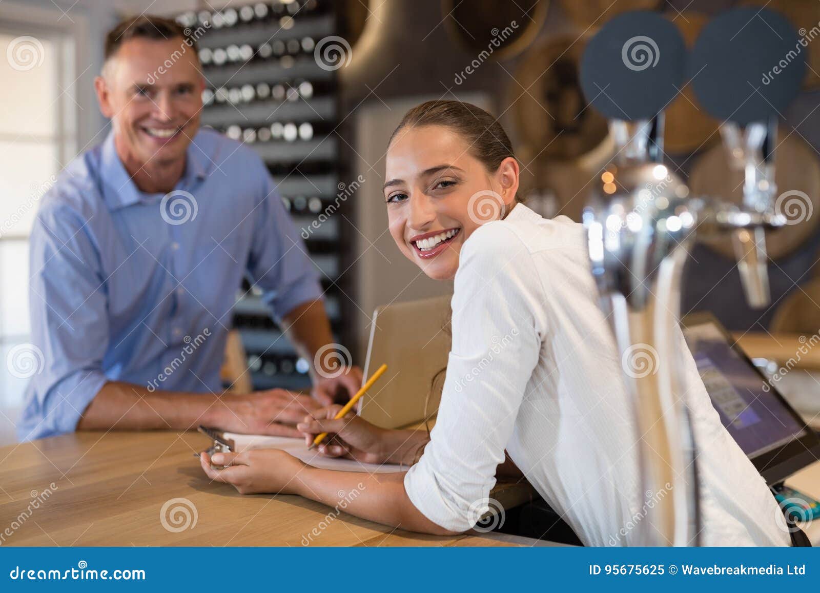 Smiling Manager and Bartender Standing at Bar Counter Stock Image ...