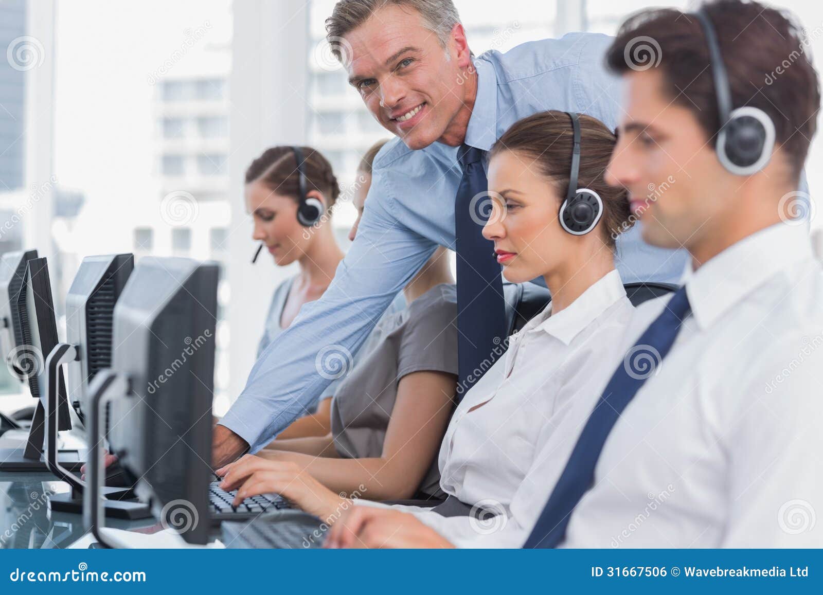 Smiling Manager Helping Call Centre Employee Stock Photo - Image of ...