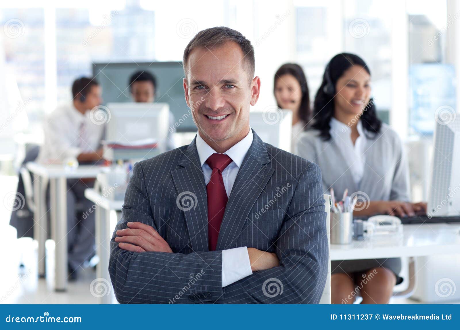 Smiling Manager Leading His Team Stock Image - Image of crossed ...