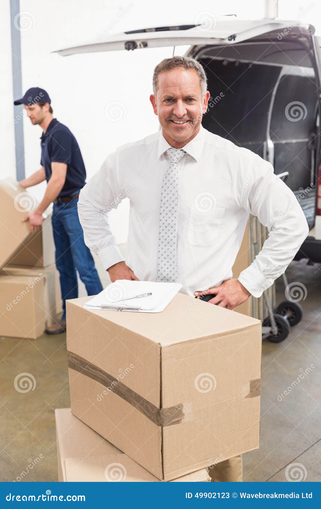 Smiling Manager Standing Behind Stack of Cardboard Boxes Stock Image ...