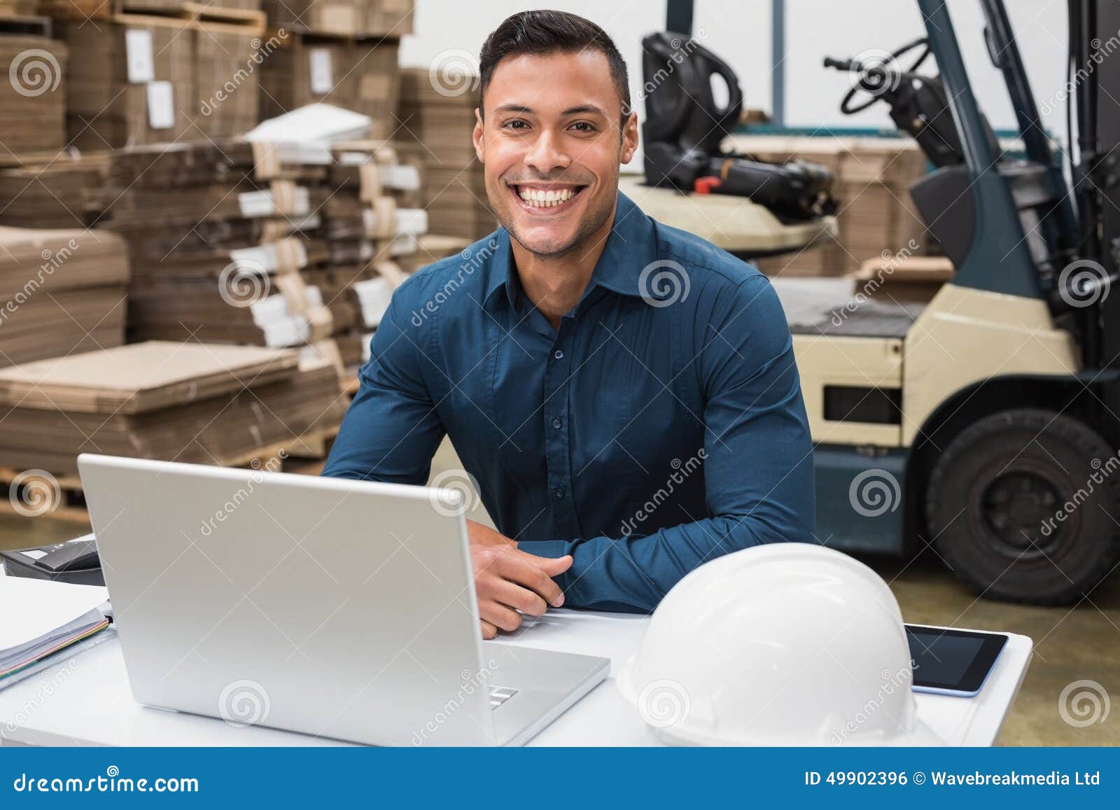 Smiling Manager Using His Laptop Stock Photo - Image of male, indoors ...