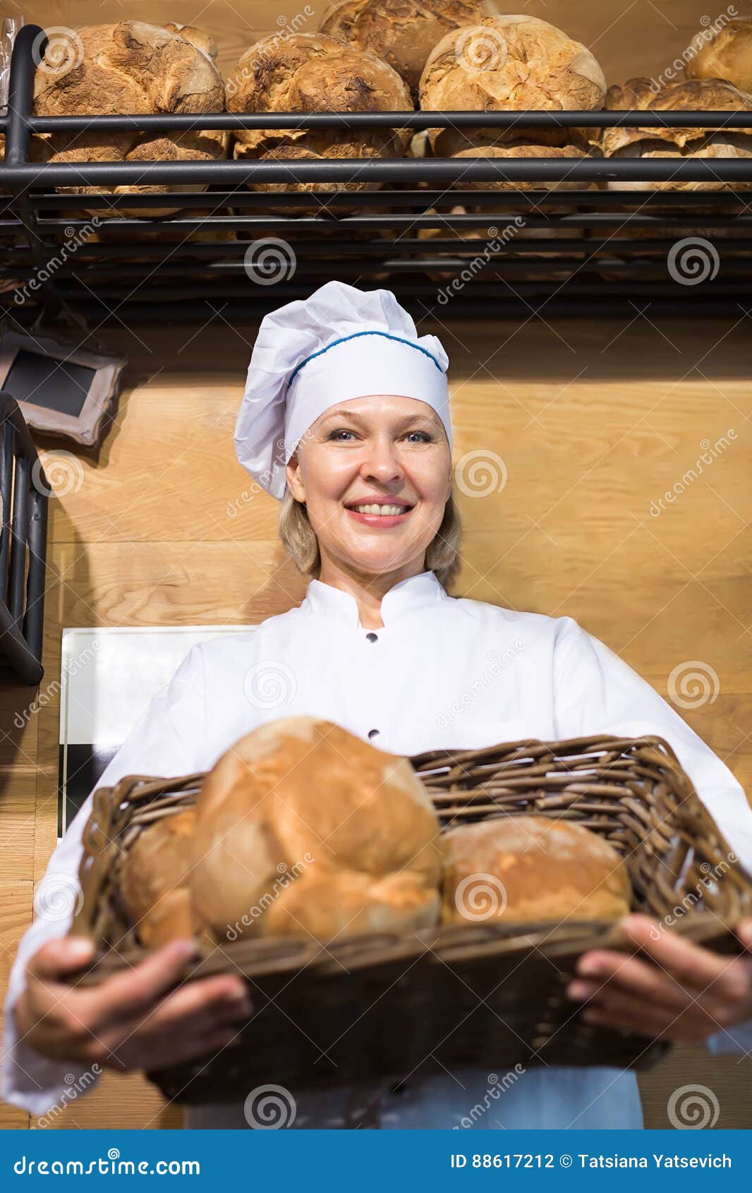 Smiling Mature Bakery Employee Working in Bakery Stock Photo - Image of ...