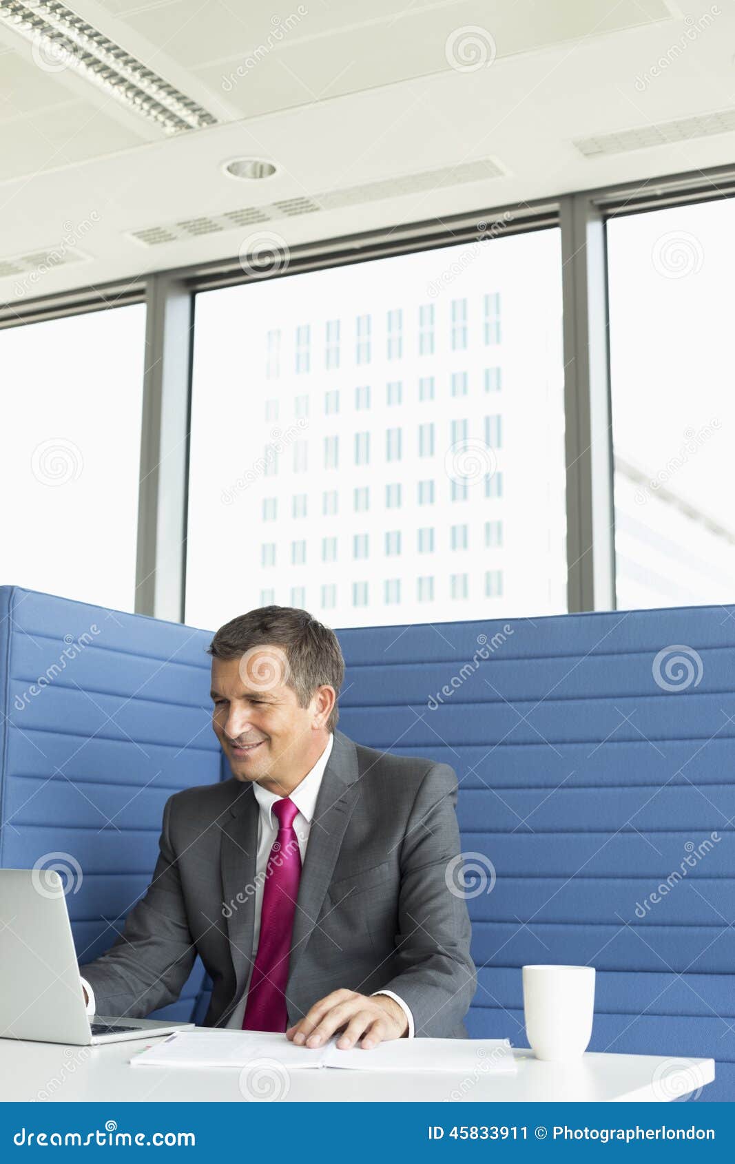 Smiling Mature Businessman Using Laptop at Desk Stock Image - Image of ... Smiling Mature Businessman Using Laptop at Desk Stock Image - Image of ...