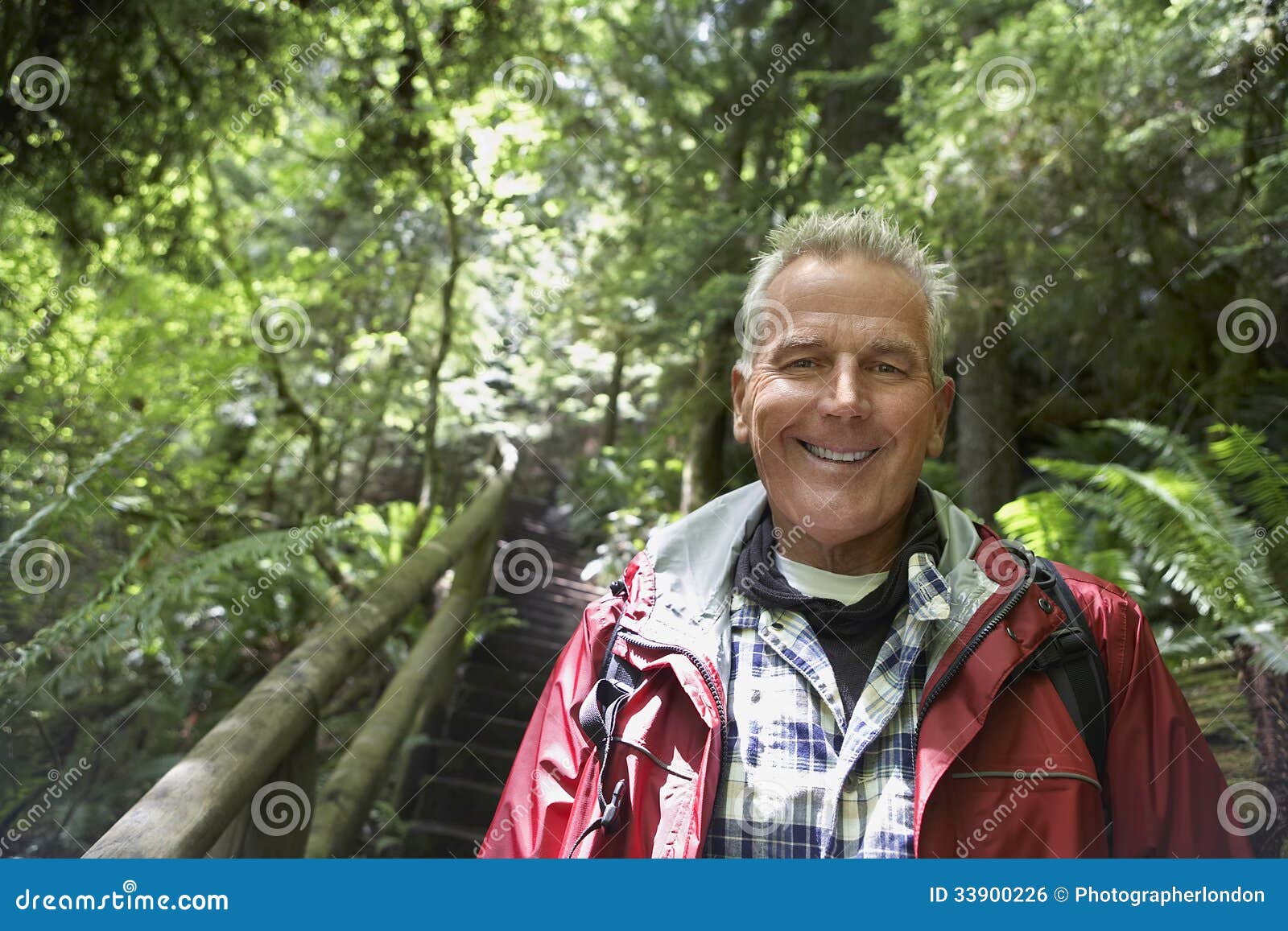 Smiling Mature Man in Forest Stock Photo - Image of lush, outdoors ...