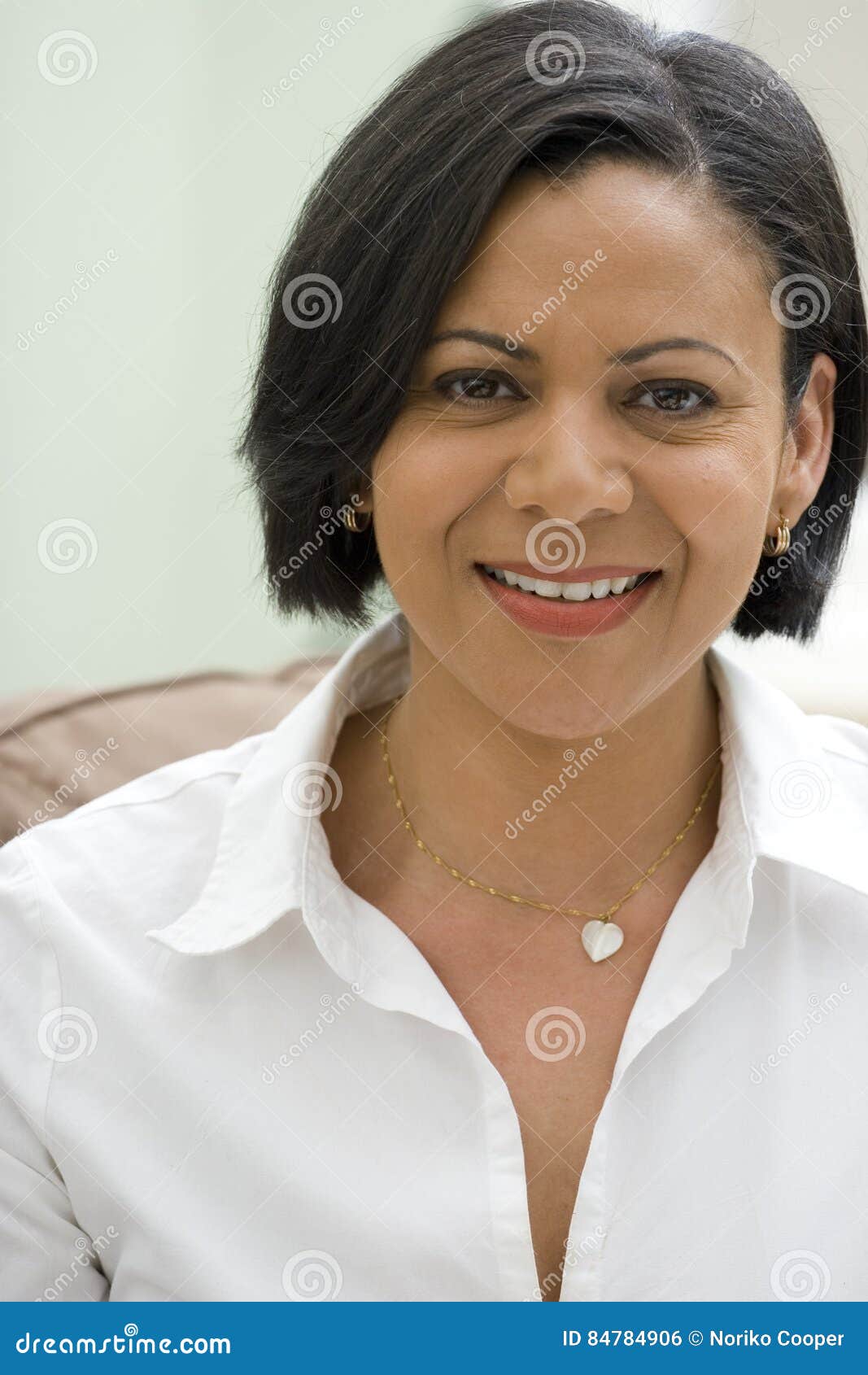 Smiling Mature Woman Sitting on Her Sofa. Stock Photo - Image of couch ... Smiling Mature Woman Sitting on Her Sofa. Stock Photo - Image of couch ...