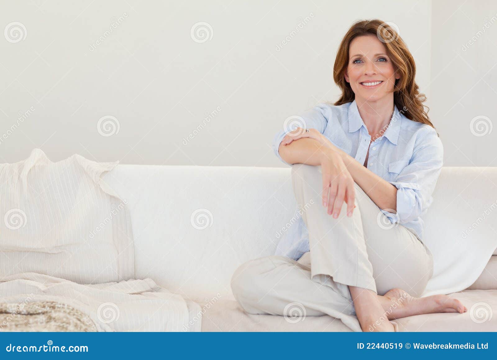 Smiling Mature Woman Sitting on Sofa Stock Image - Image of mature ...