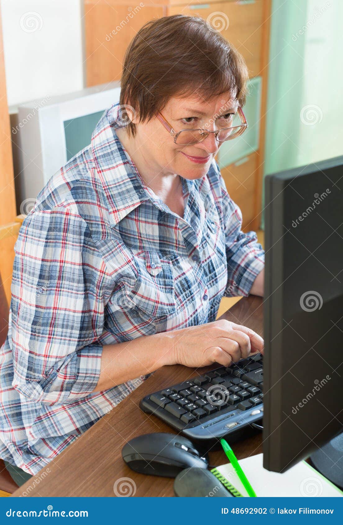 Smiling Mature Woman Using Keyboard Stock Photo - Image of pensioner ...