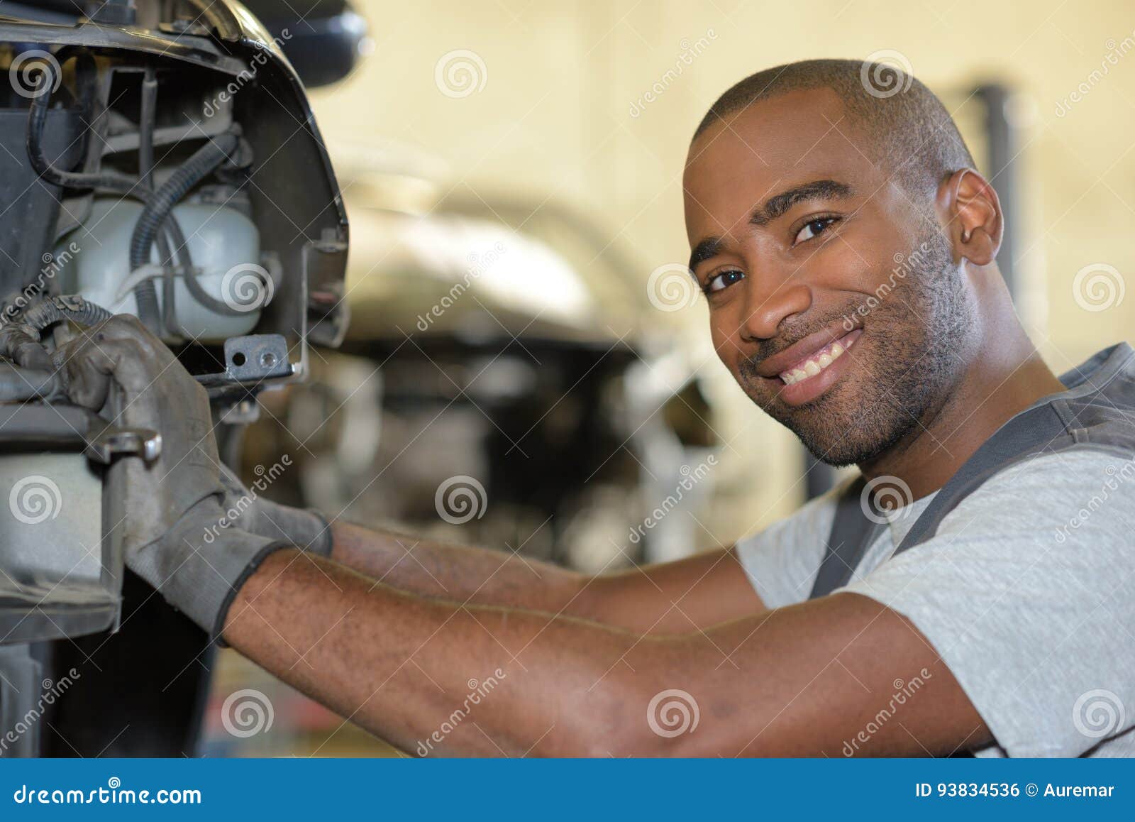 Smiling Mechanic Fixing Car Engine in Garage Stock Photo - Image of ...