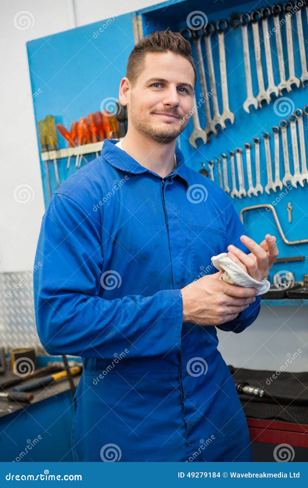 Smiling Mechanic Looking at Camera Stock Photo - Image of coveralls ...
