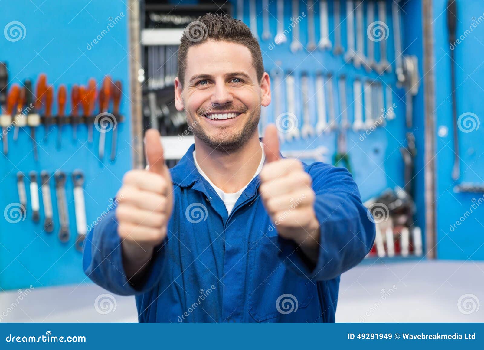 Smiling Mechanic Looking at Camera Stock Image - Image of expertise ...