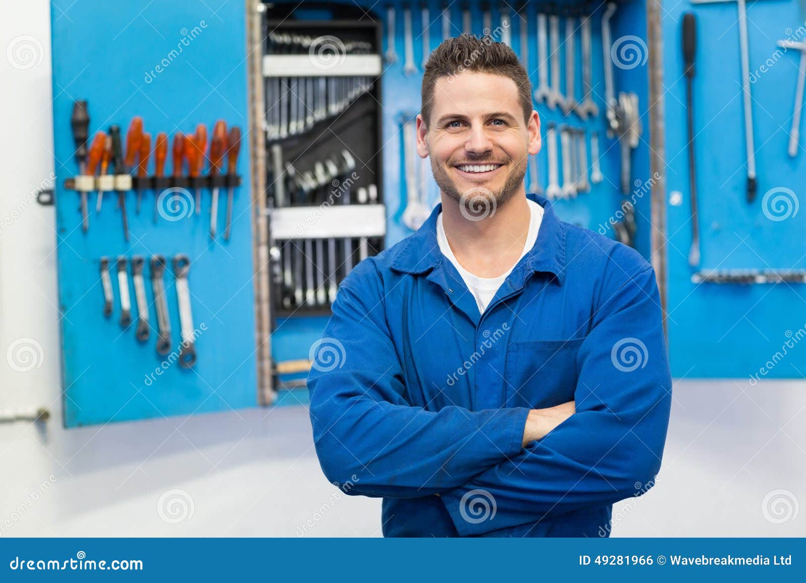 Smiling Mechanic Looking at Camera Stock Photo - Image of workshop ...