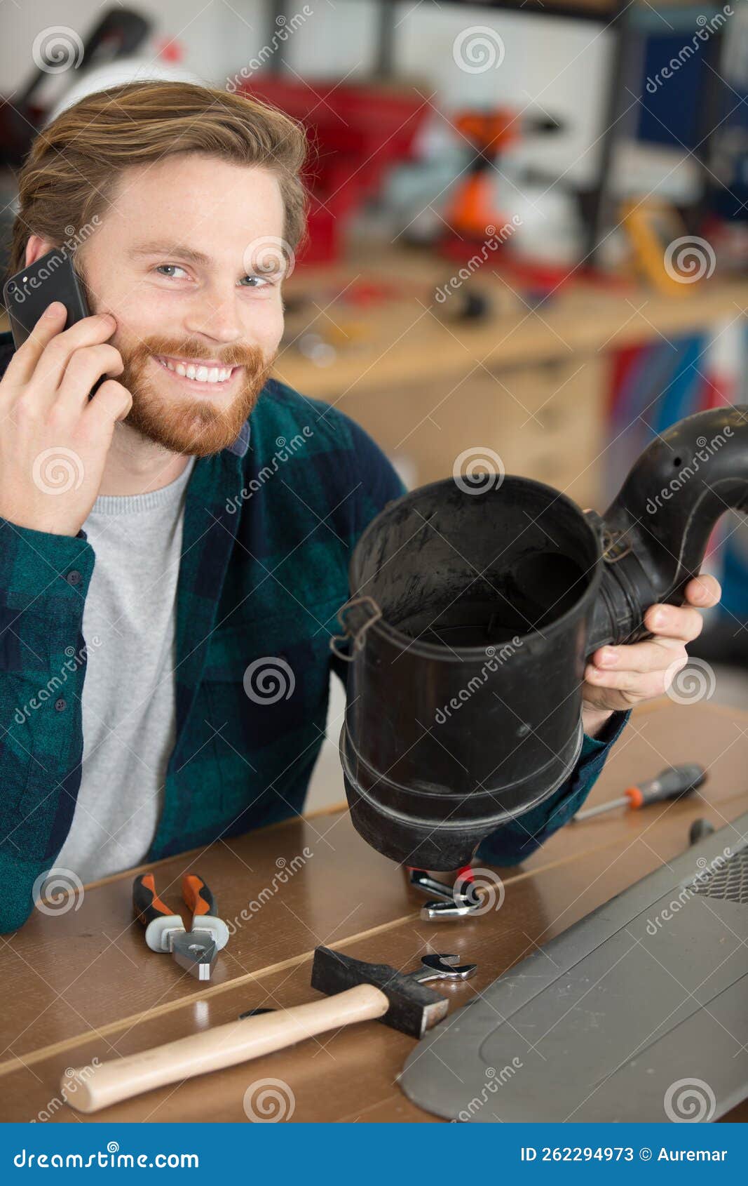 Smiling Mechanic on Phone at Repair Garage Stock Image - Image of ...