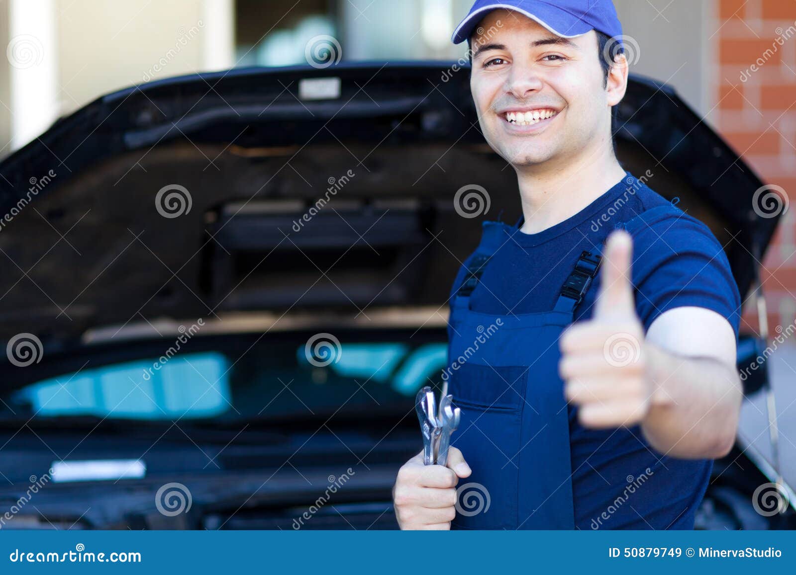 Smiling mechanic thumbs up stock image. Image of service - 50879749