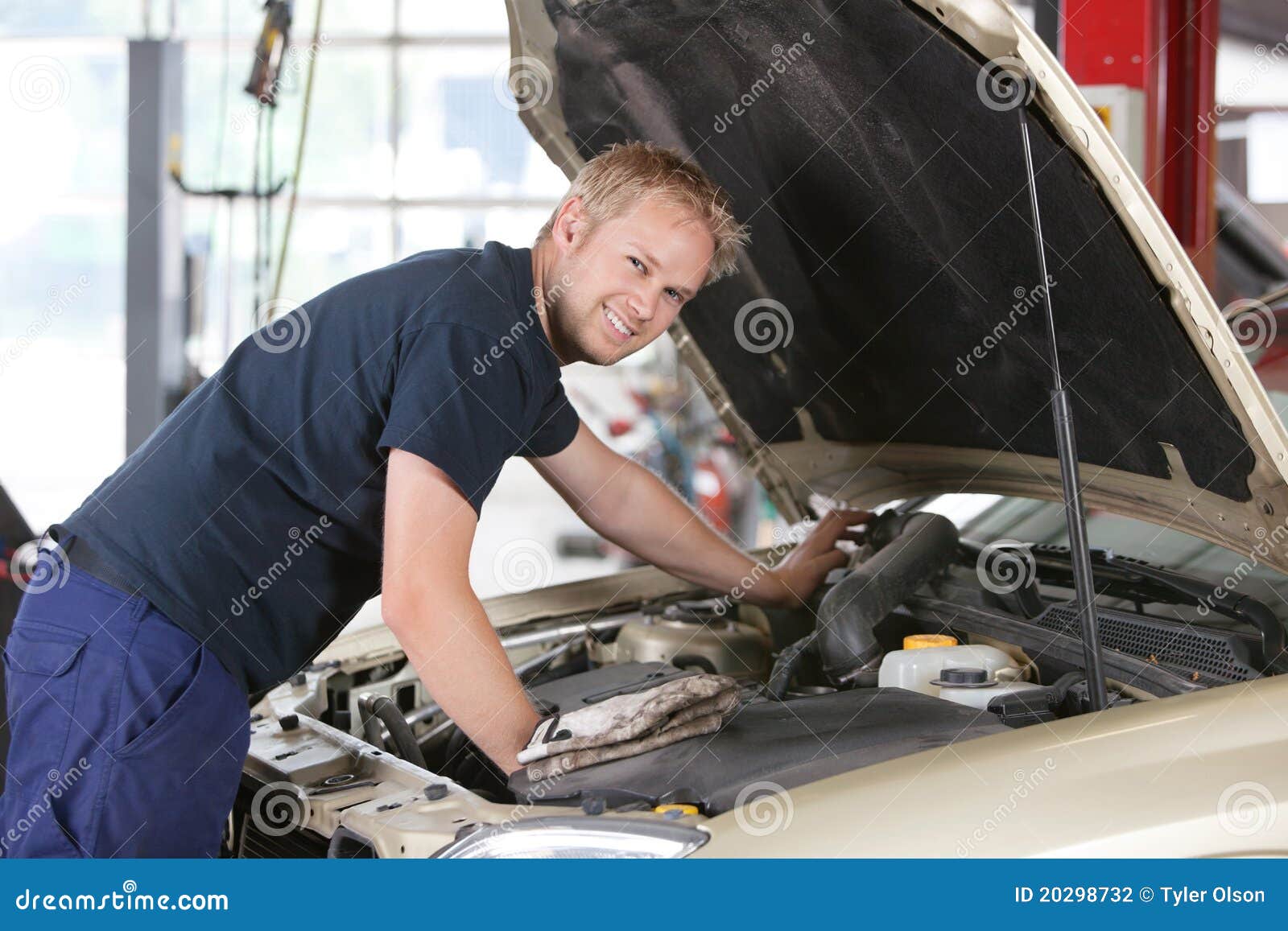 Smiling Mechanic Working on Car Stock Photo - Image of open, horizontal ...