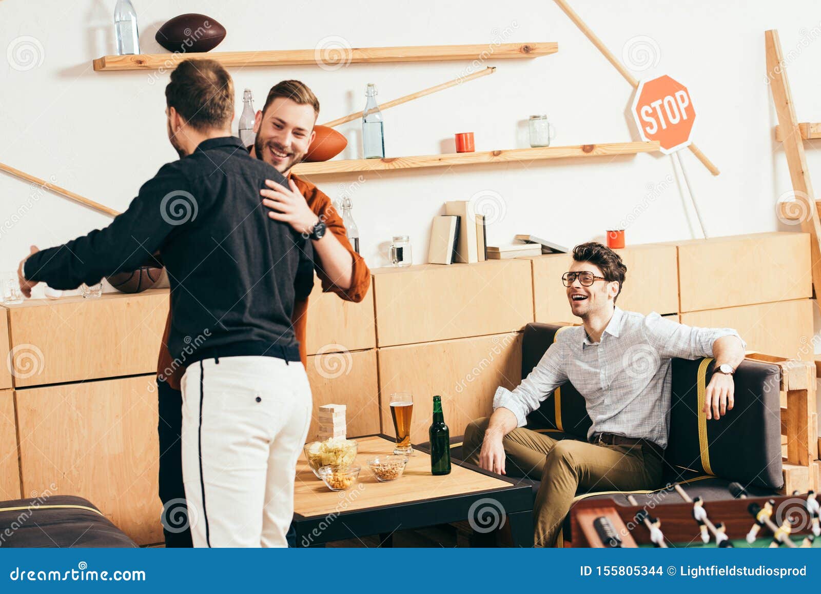 Smiling Men Hugging while Greeting Each Other Stock Photo - Image of ...