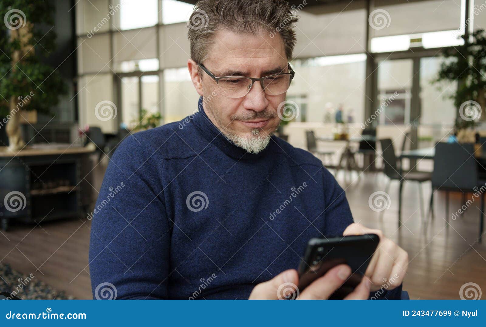 Middle Age Man Using Phone in Restaurant or Cafe Stock Image - Image of ...