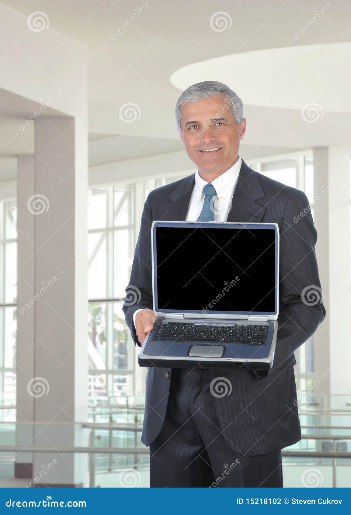 Smiling Middle Aged Businessman with Computer Stock Photo - Image of ...
