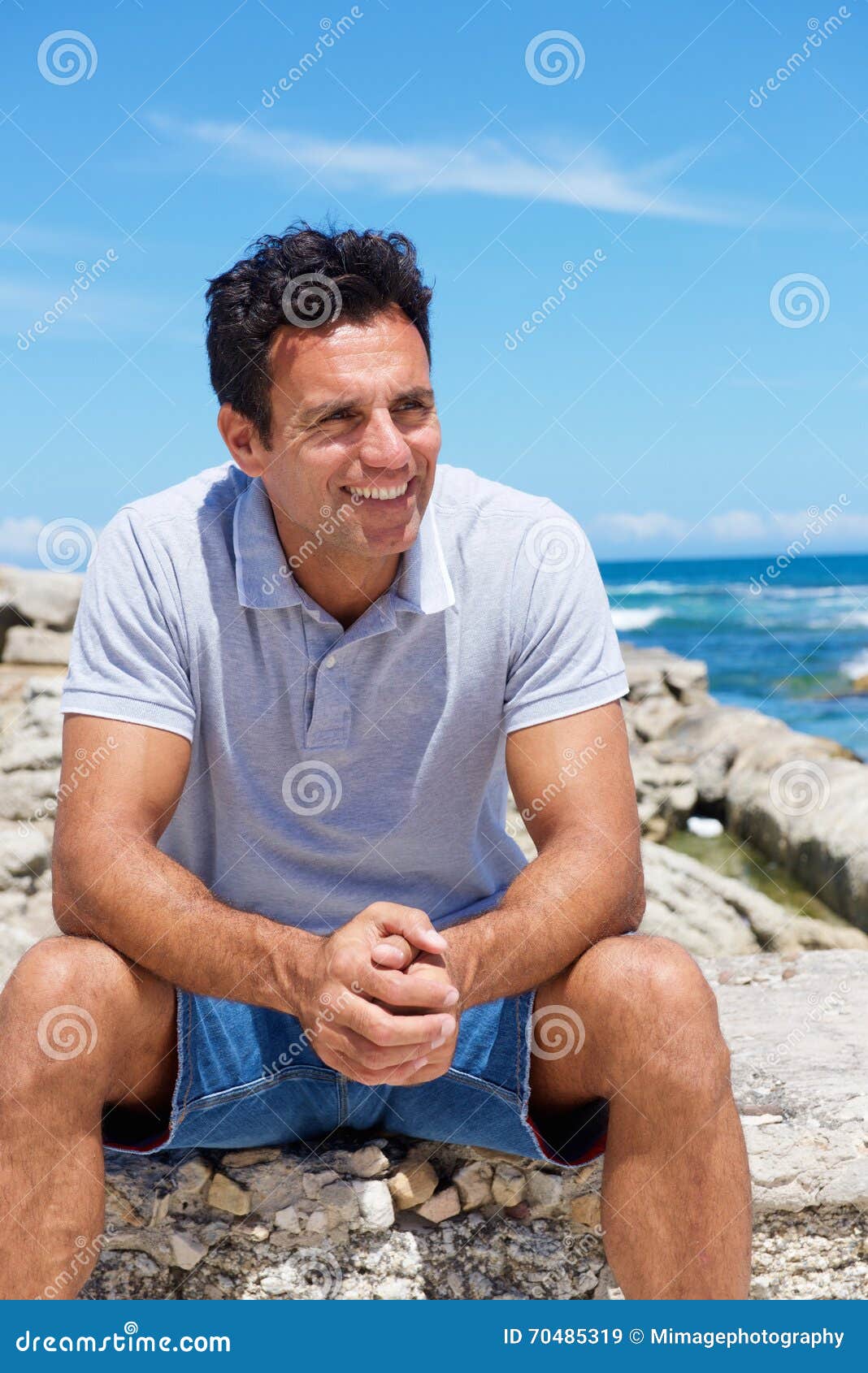 Smiling Middle Aged Man Sitting by the Beach Stock Image - Image of ...