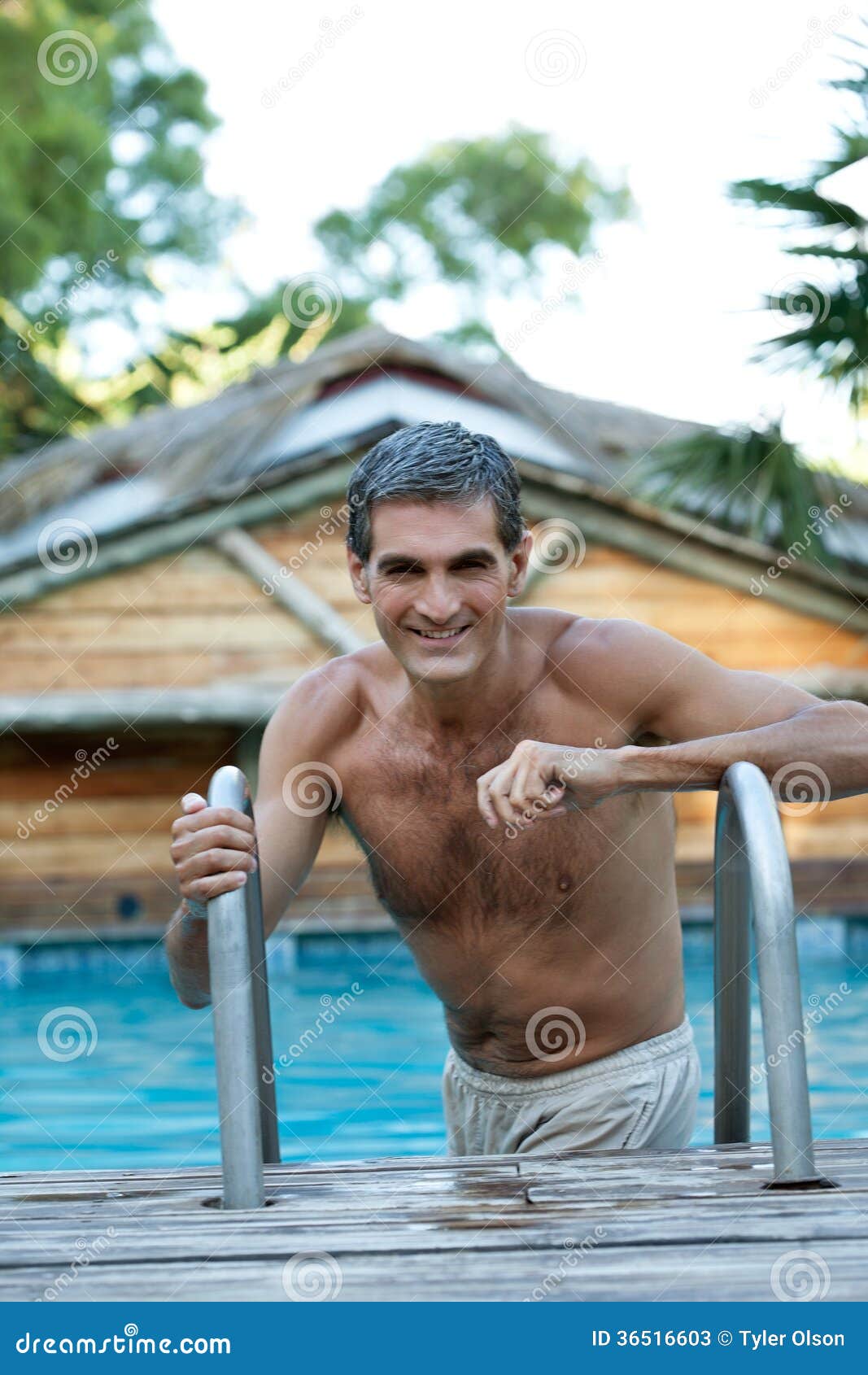 Smiling Middle Aged Man Standing in Pool Stock Image - Image of fitness ...