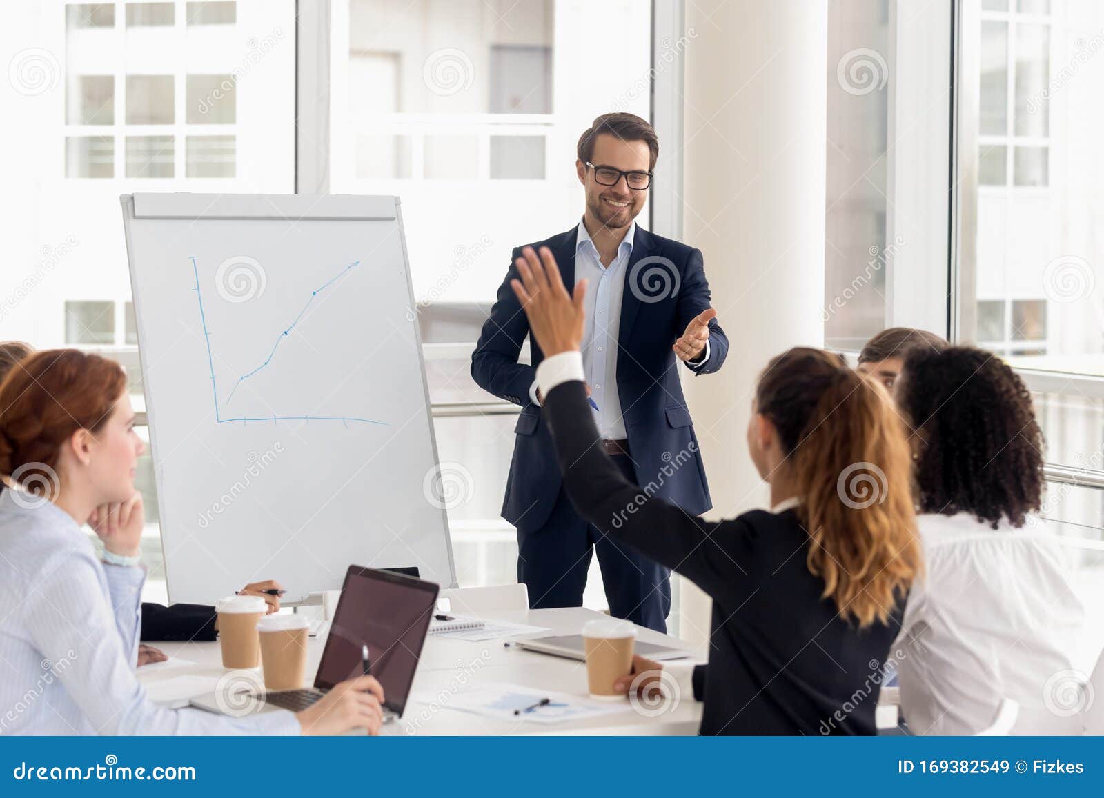 Female Employee Raise Hand Answering at Work Office Training Stock ...