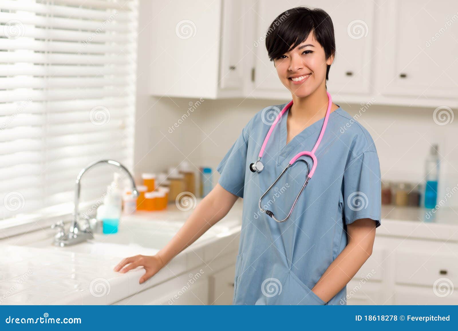 Smiling Mixed Race Doctor or Nurse in Office Stock Photo - Image of ...