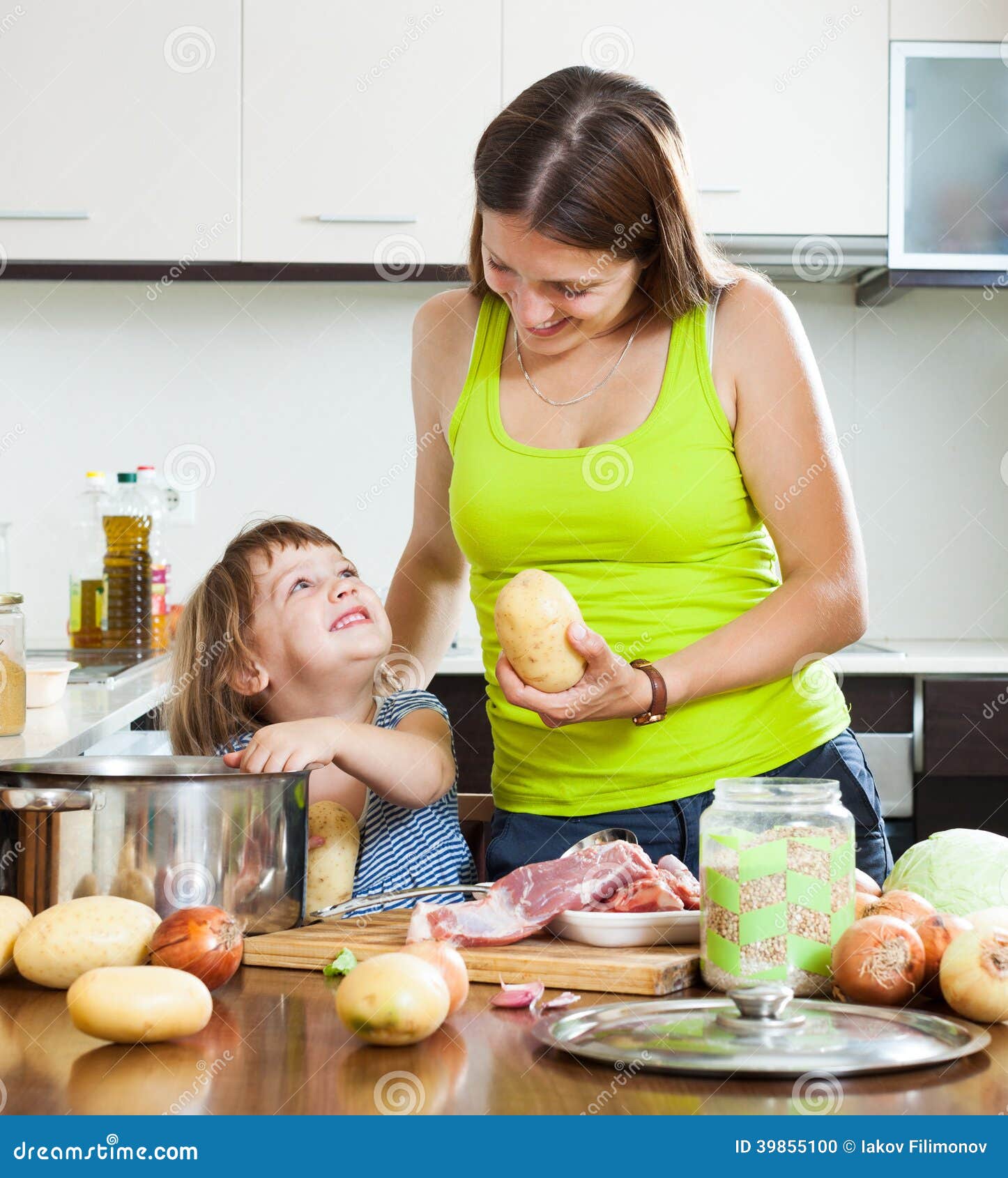 Smiling Mother with Child Cooking Stock Photo - Image of kitchen ...