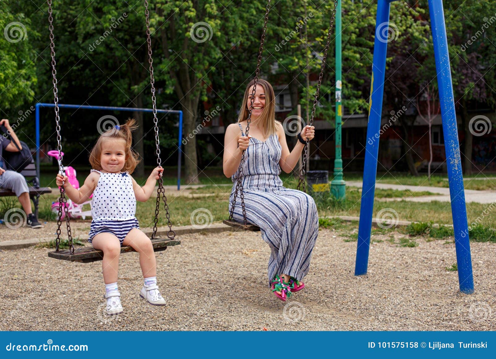 Mother and Child on Swing at Playground Stock Photo - Image of cheerful ...