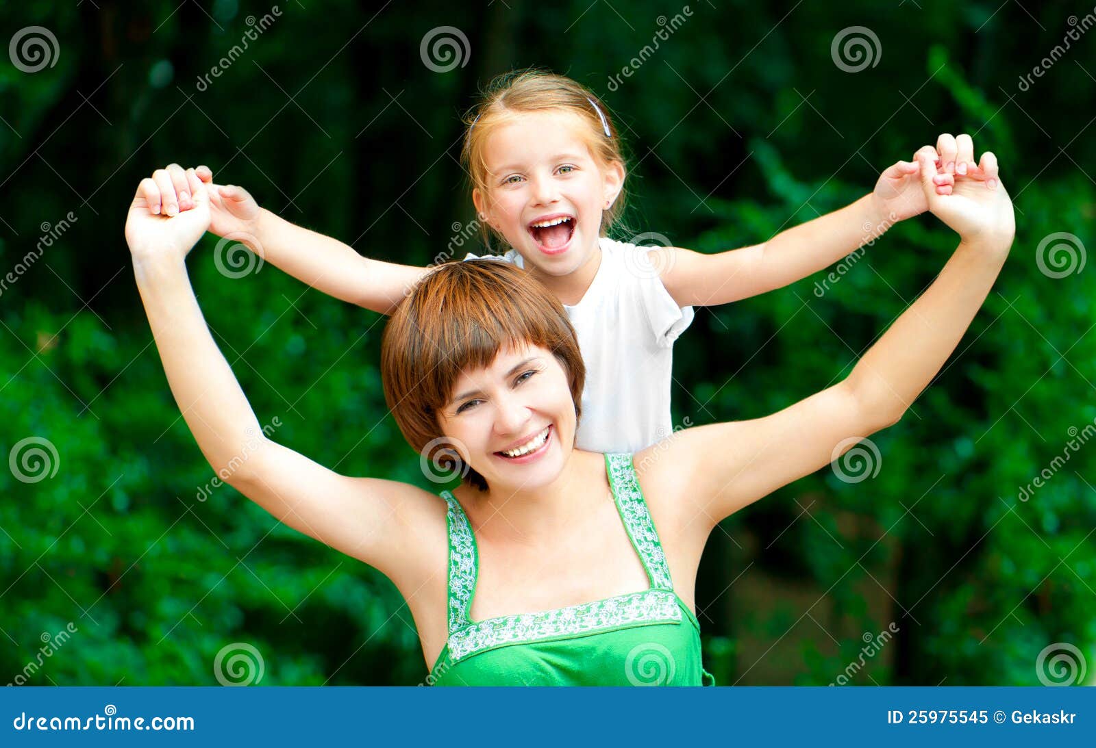 Smiling Mother and Daughter Stock Image - Image of field, happy: 25975545