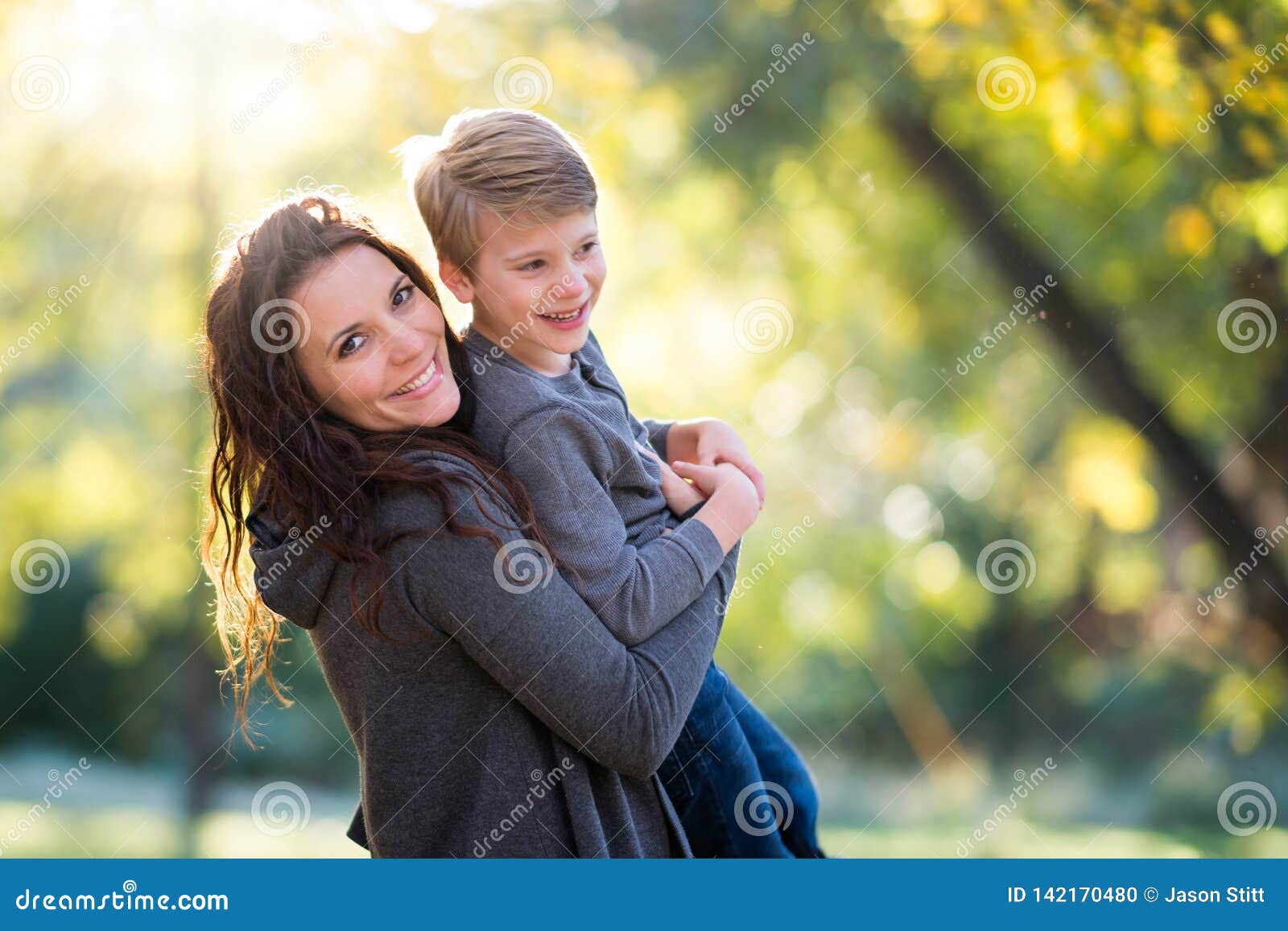 Smiling Mother and Son stock photo. Image of holding - 142170480